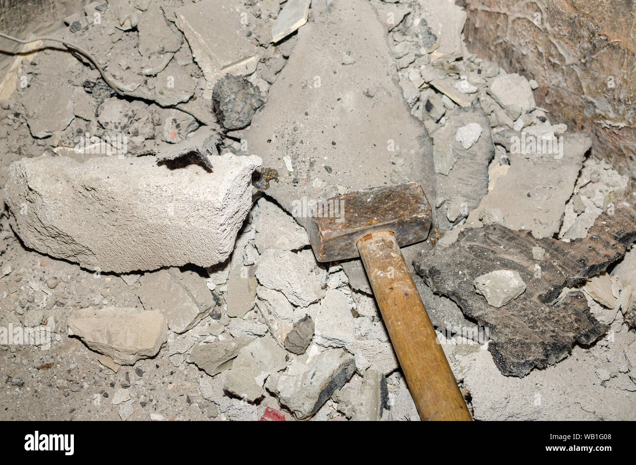 Hammer and parts of plaster after wall destruction works Stock Photo ...