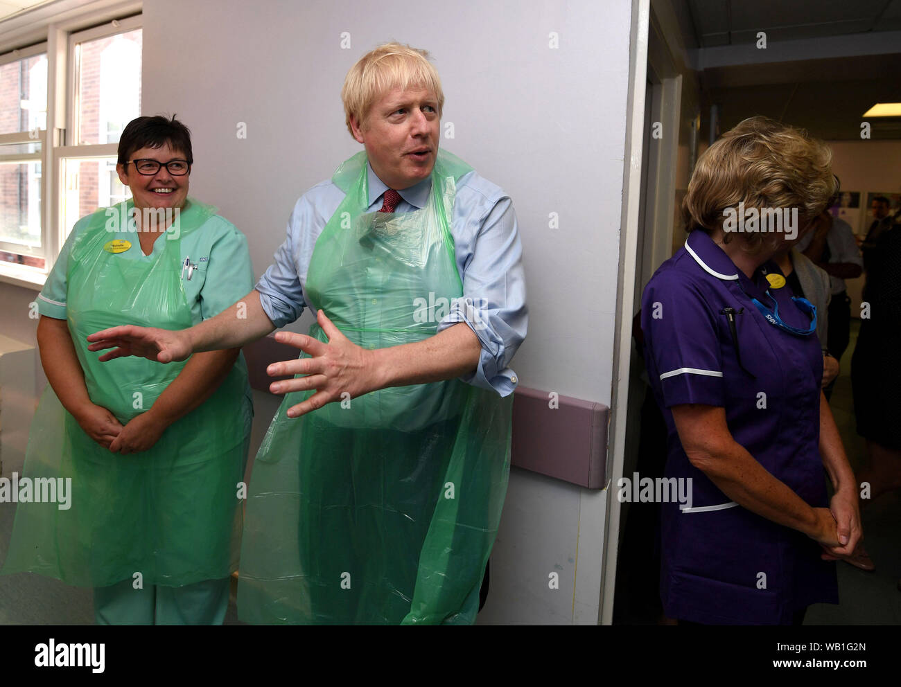 Prime Minister Boris Johnson speaks to staff during a visit to Torbay ...