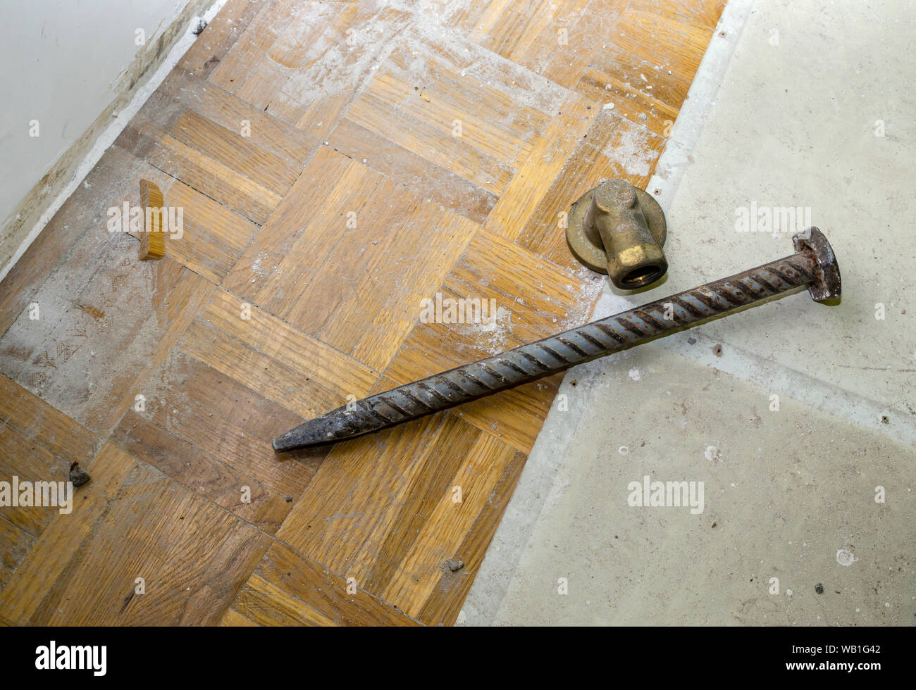 Old generation of wall chaser on a wooden floor during renovation works ...