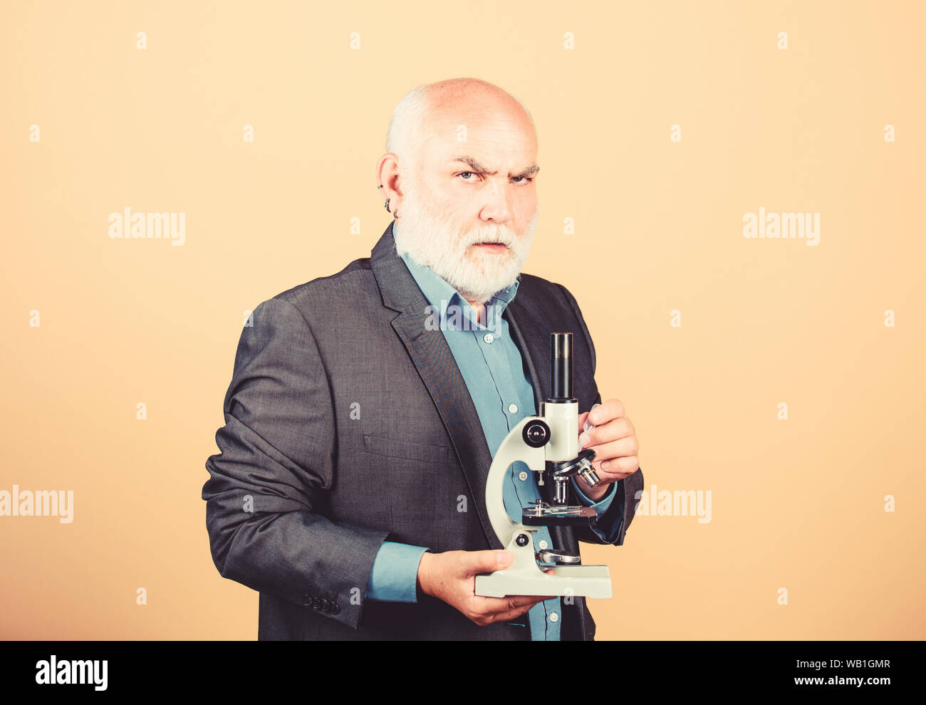 Molecular biology PhD projects. Mature man formal suit with microscope ...