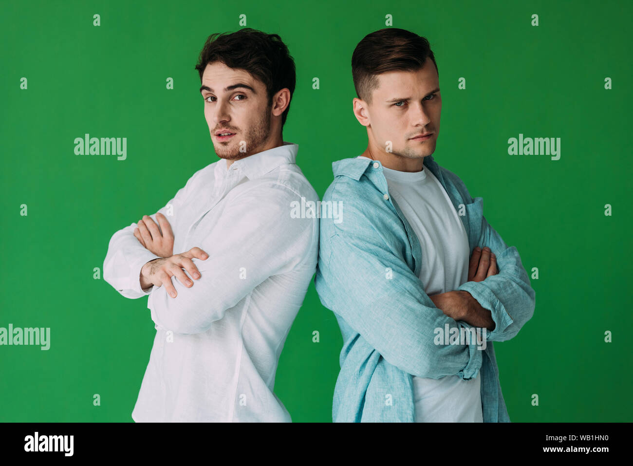 Two men standing with arms crossed hi-res stock photography and images ...