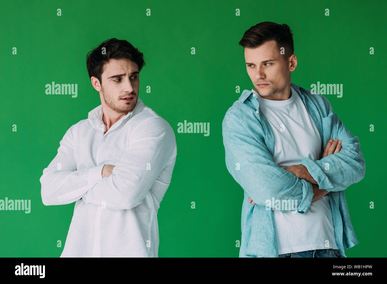 Two men standing with arms crossed hi-res stock photography and images ...