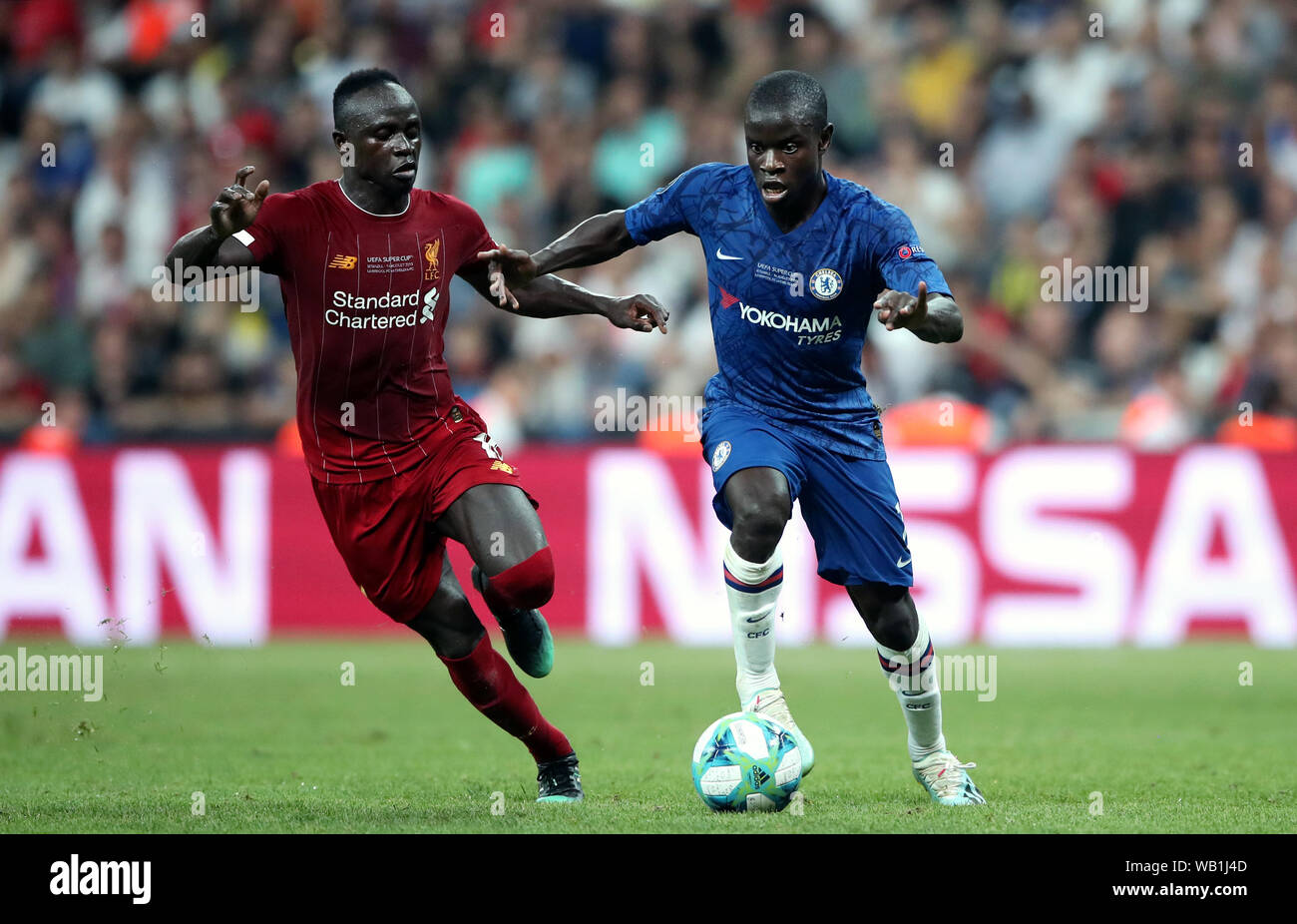 Chelsea's N'Golo Kante holds off Liverpool's Sadio Mane during the UEFA ...