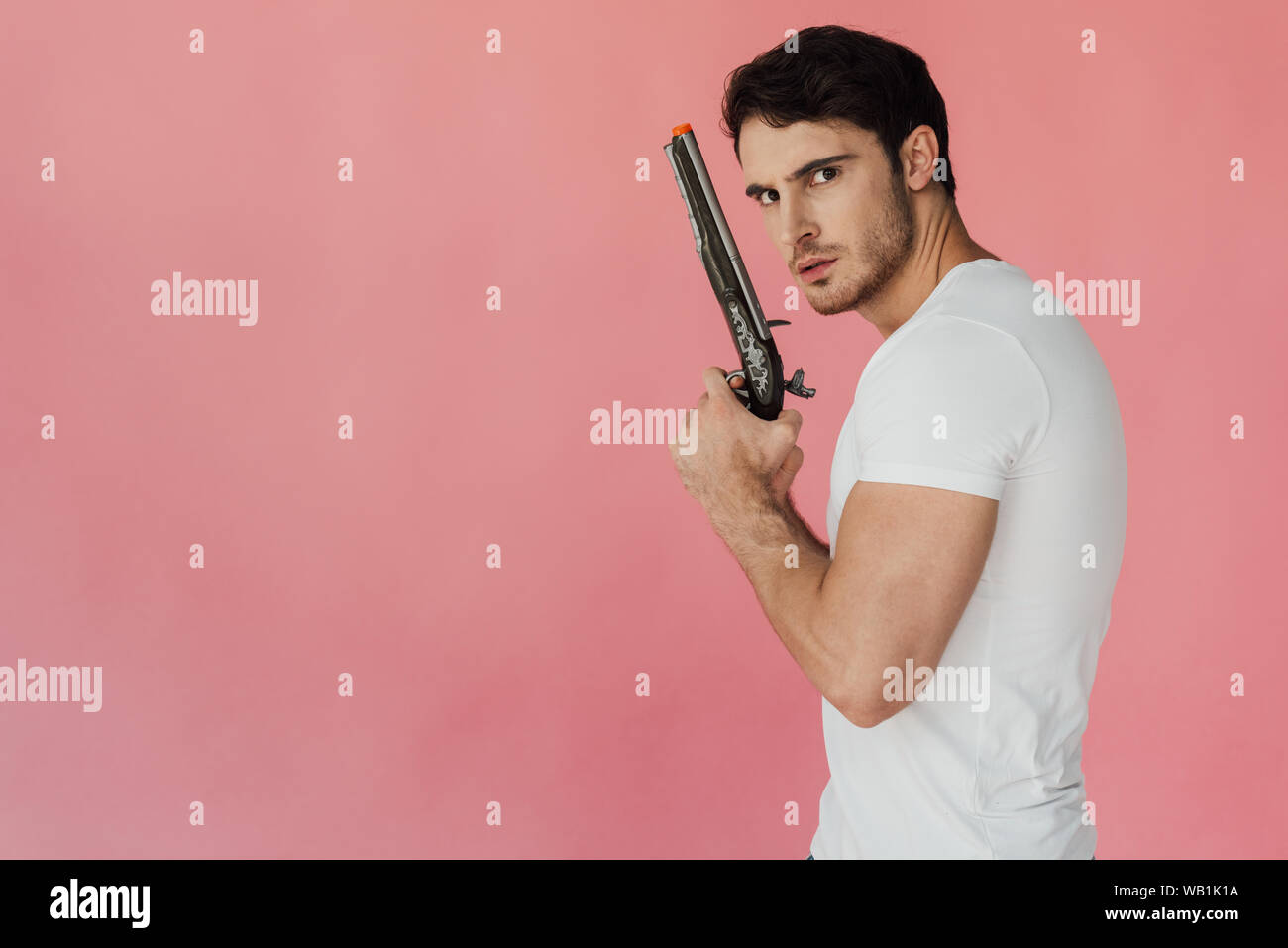 Muscular man gun hi-res stock photography and images - Alamy