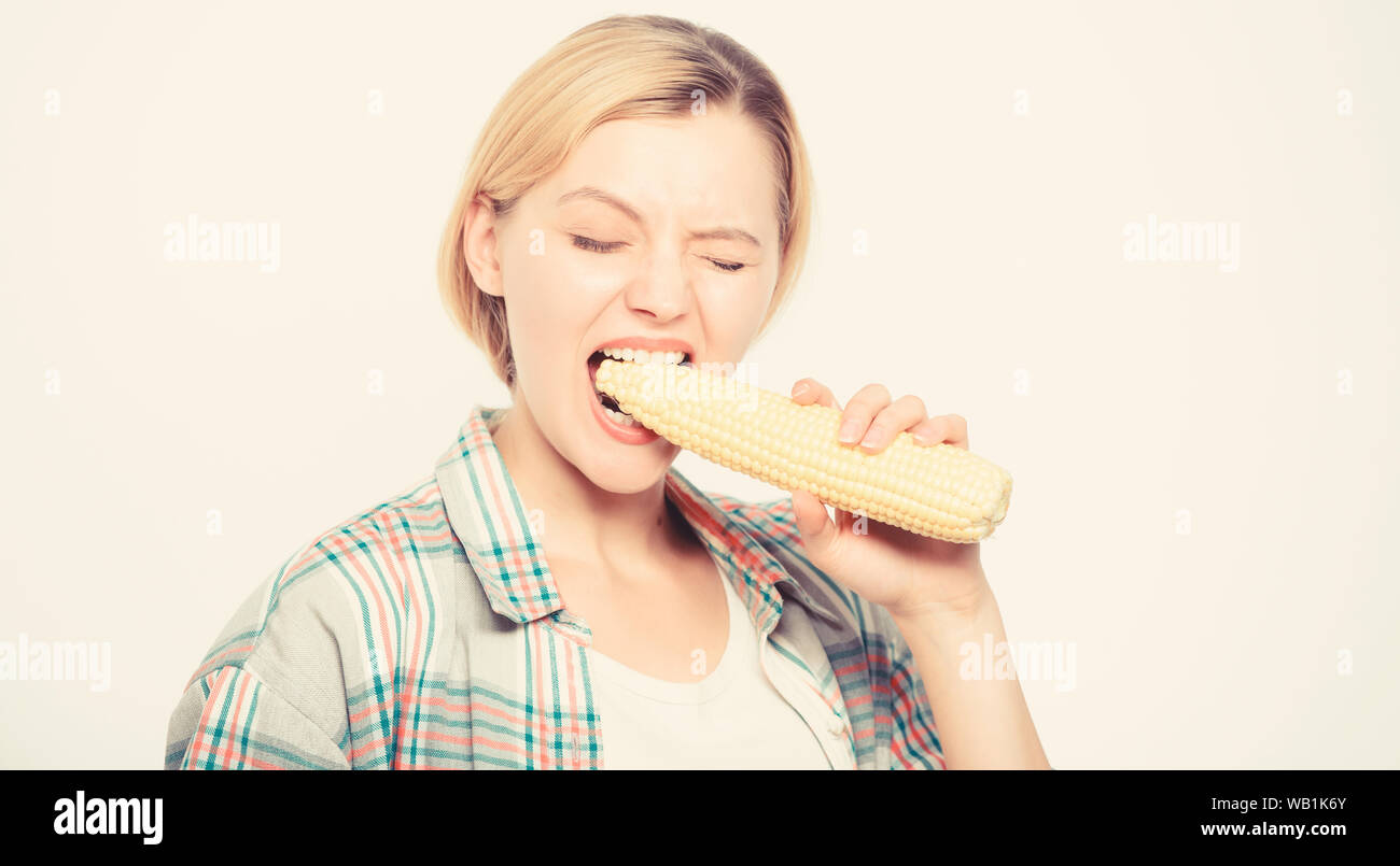 strong teeth of woman bite raw corn. healthy teeth. Farming, farmer ...