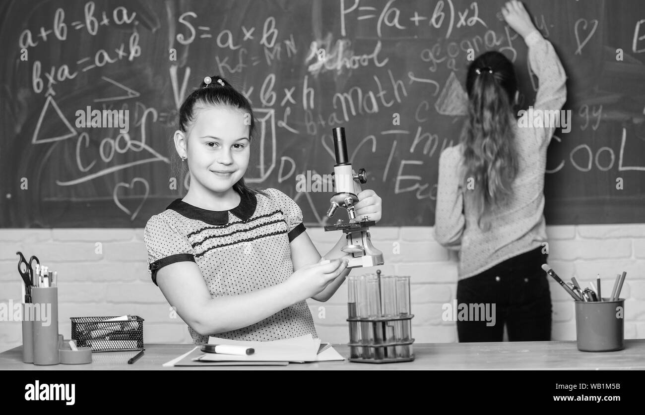 I can cure you. Little girls in school lab. Formal school education ...