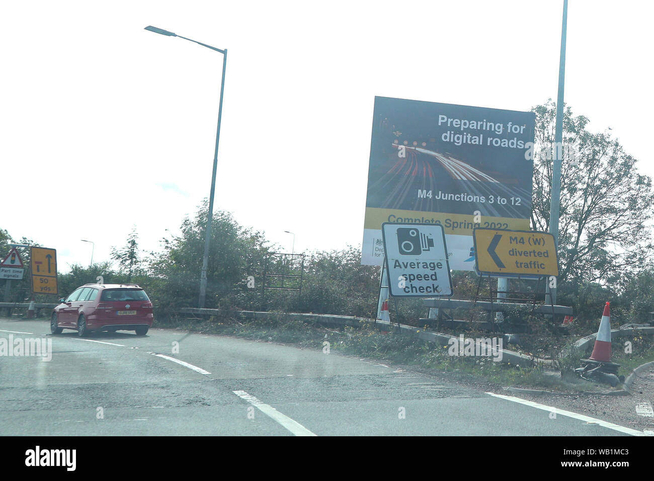 A sign announcing the forthcoming 'smart motorway' on the M4 road in ...