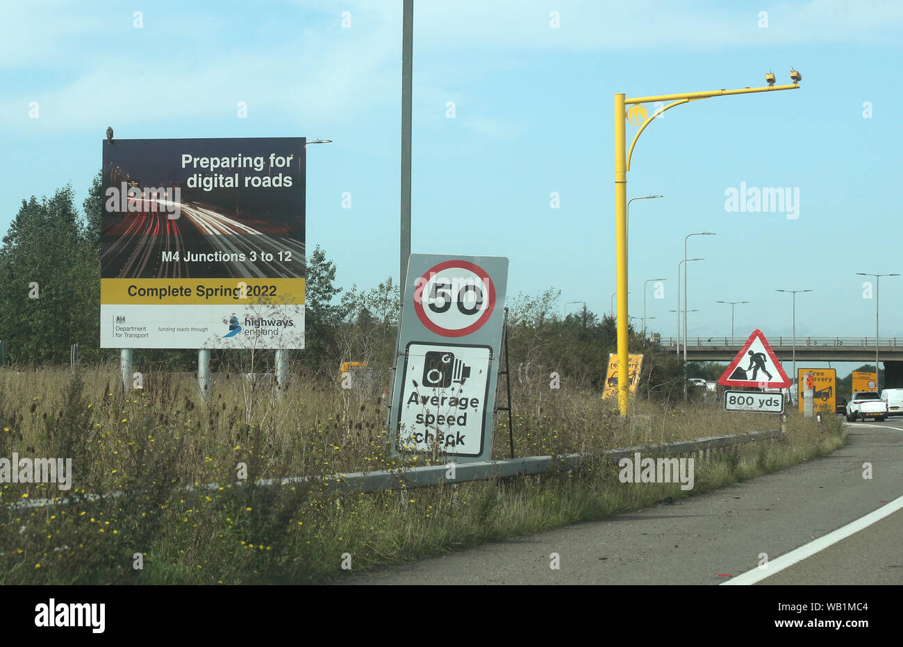 A sign announcing the forthcoming 'smart motorway' on the M4 road in ...