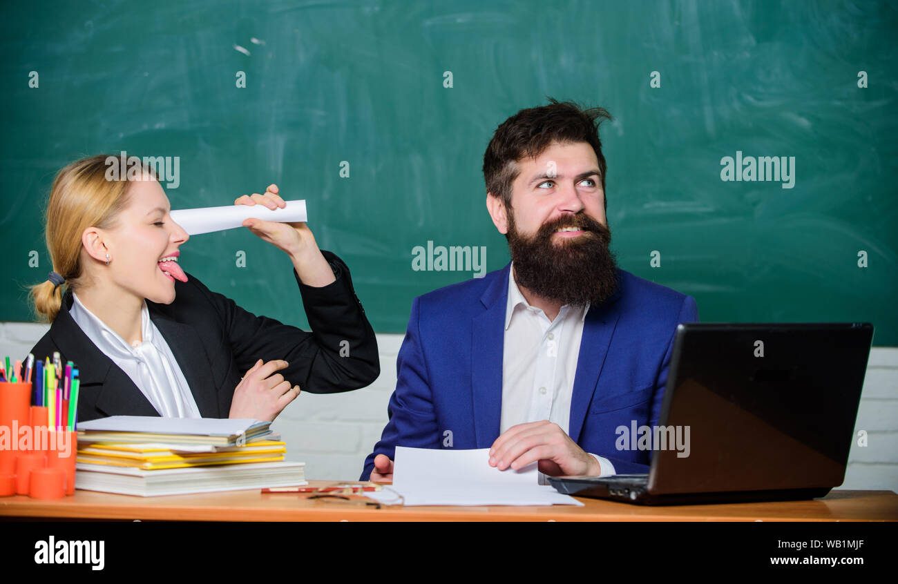 Professional differences. Teacher and supervisor working in school ...