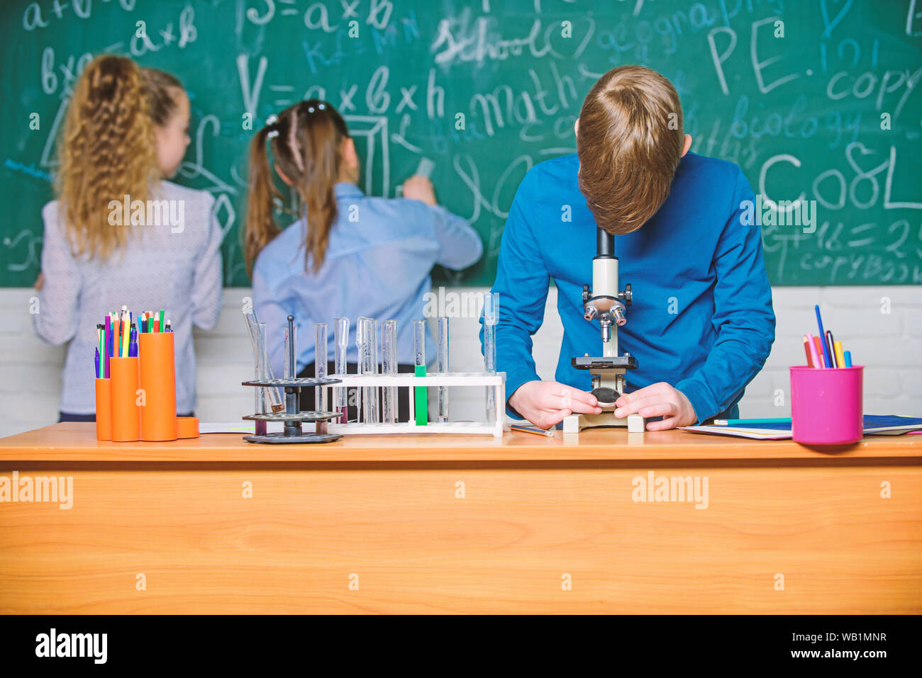 Little kids learning chemistry in lab. Chemistry equipment. Happy ...