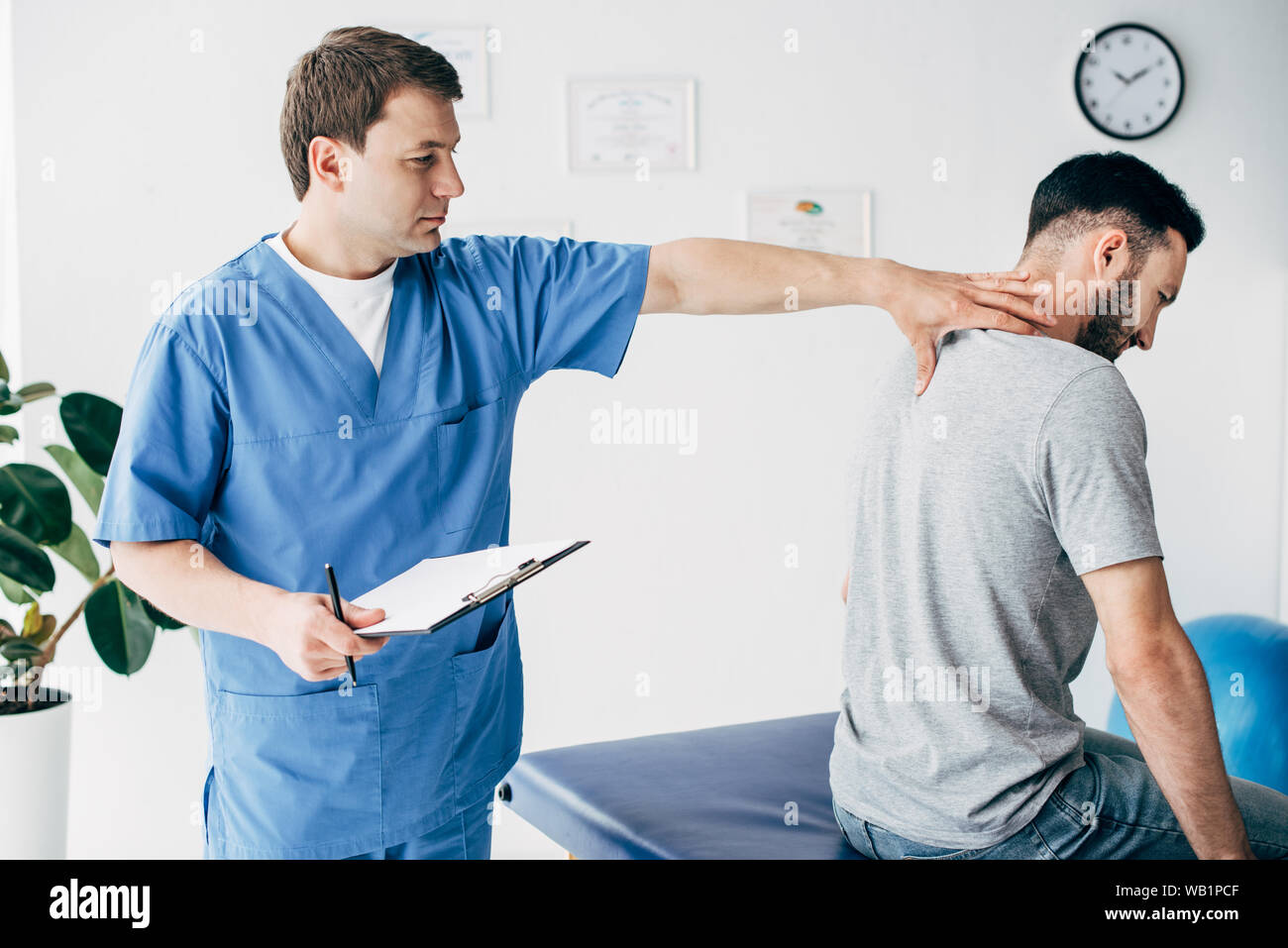 chiropractor with diagnosis and pen massaging neck of man in hospital ...