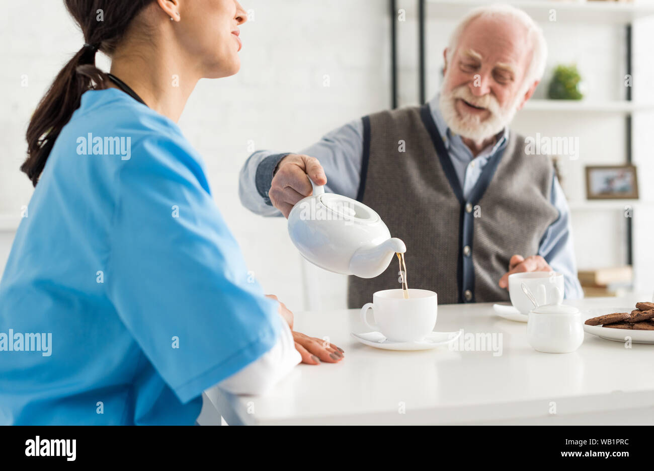 Senior man pouring tea hi-res stock photography and images - Alamy