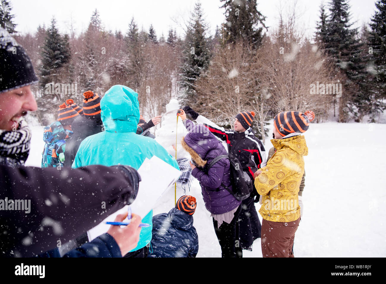 group of young happy business people after a competition measuring the ...