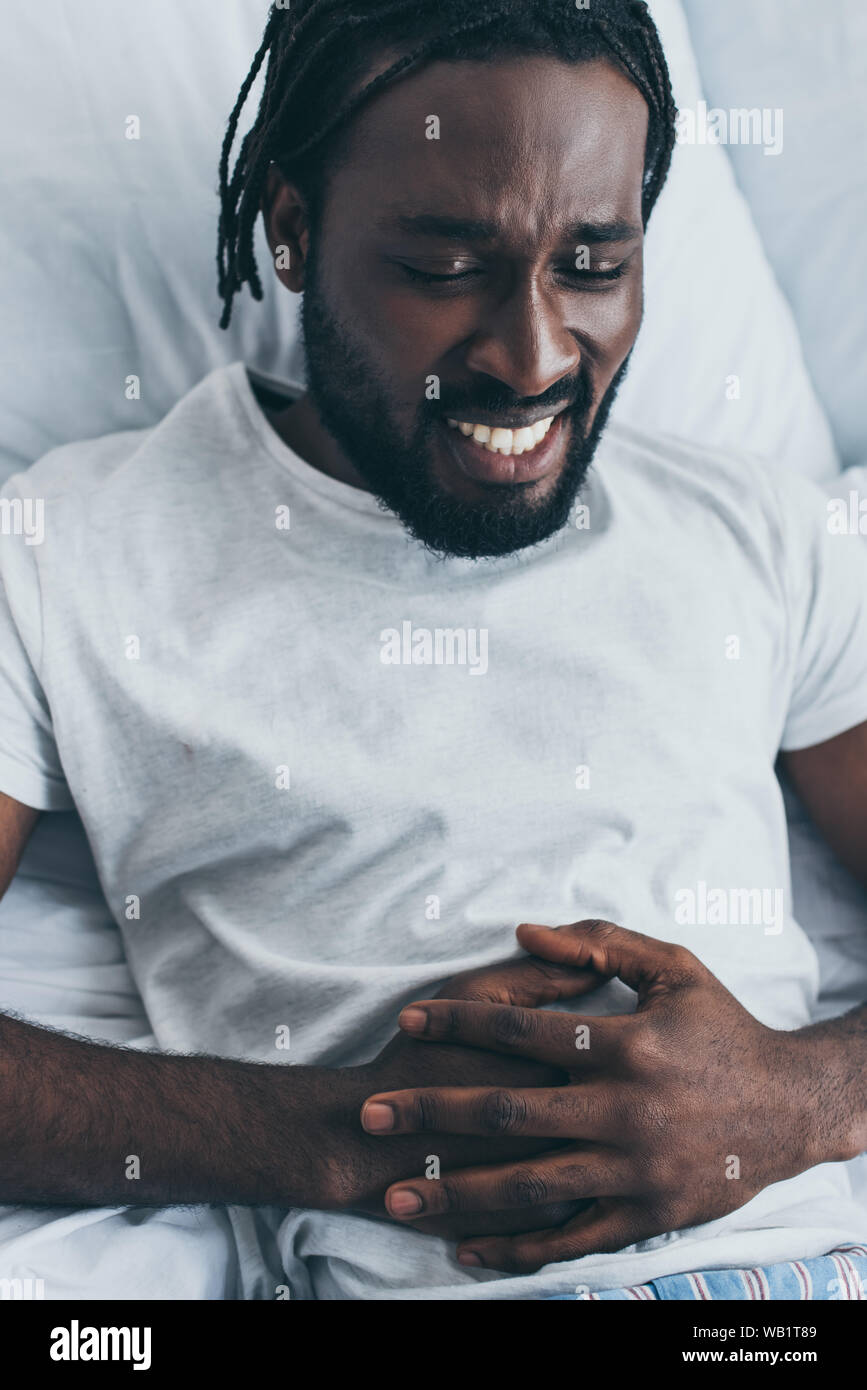 African american man suffering stomach hi-res stock photography and ...