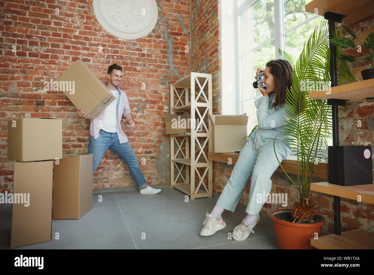 Build the future together. Young couple moved to a new house or ...