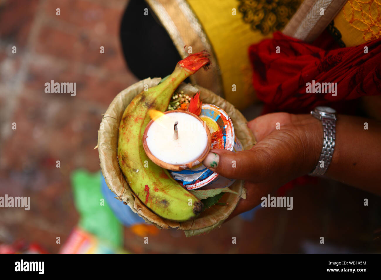 A devotee performs rituals during the Celebration.Janmasthami is ...