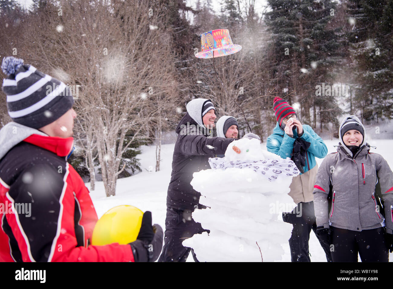 group of young happy business people having a competition in making ...