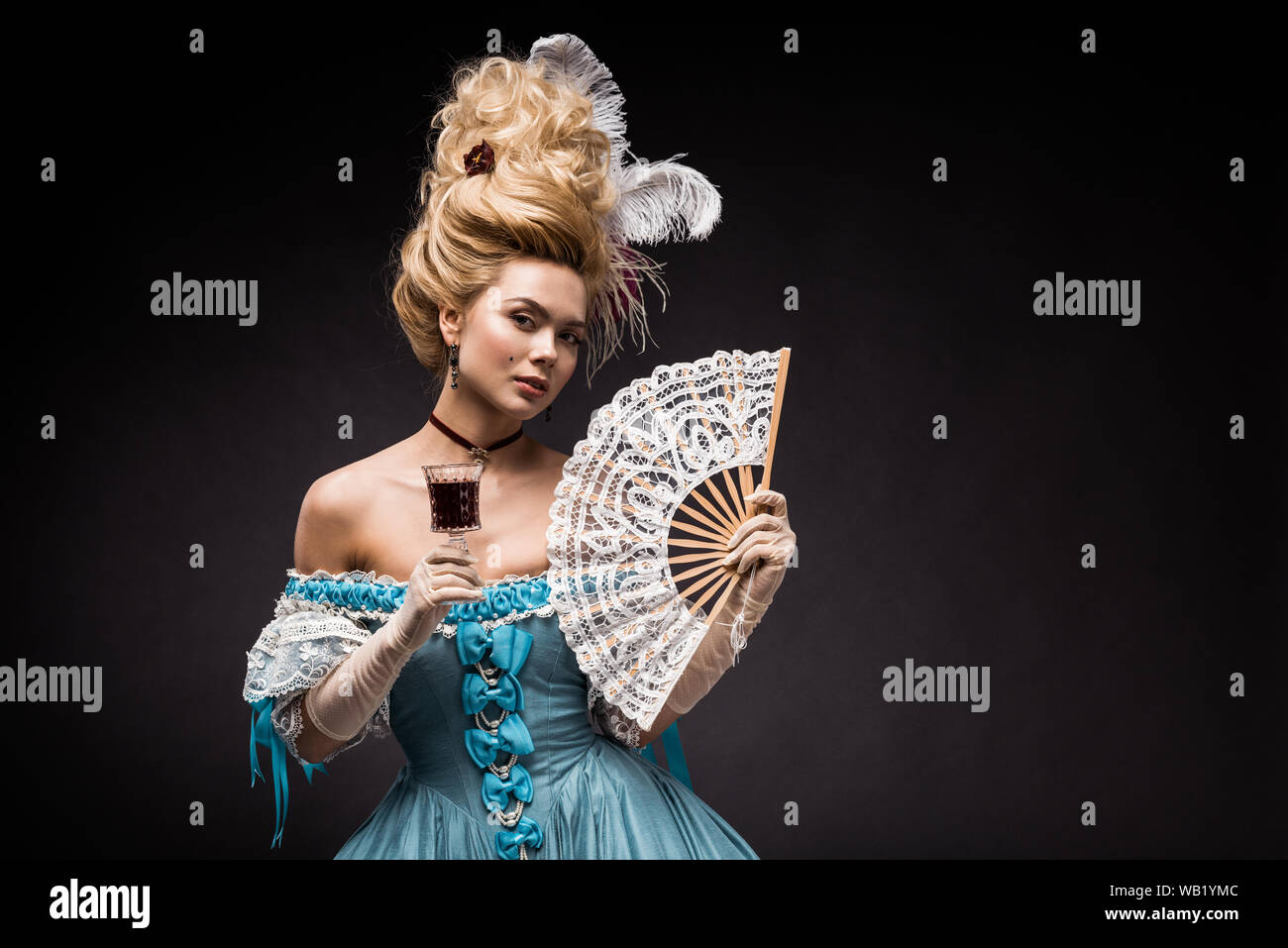 Woman Holding Fan High Resolution Stock Photography and Images - Alamy