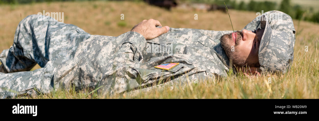 Soldier lying in the grass hi-res stock photography and images - Alamy