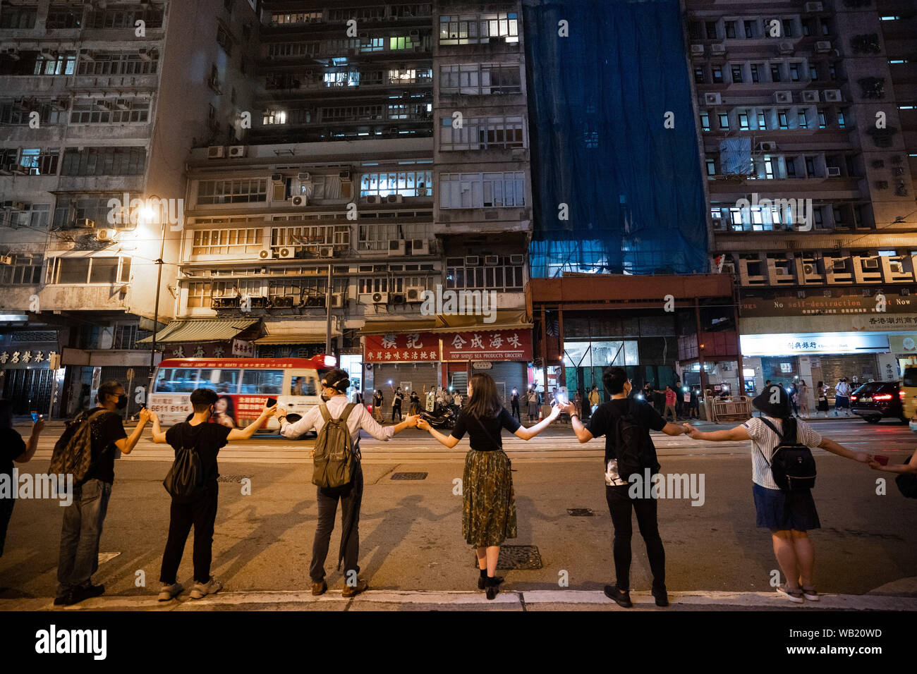 Protester holding hands to form a human chain during the Hong Kong way ...