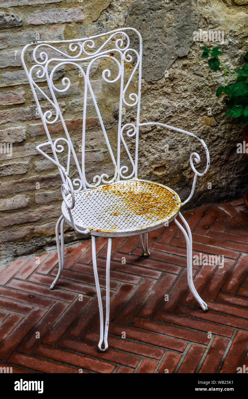 vintage rusty white chair Stock Photo - Alamy