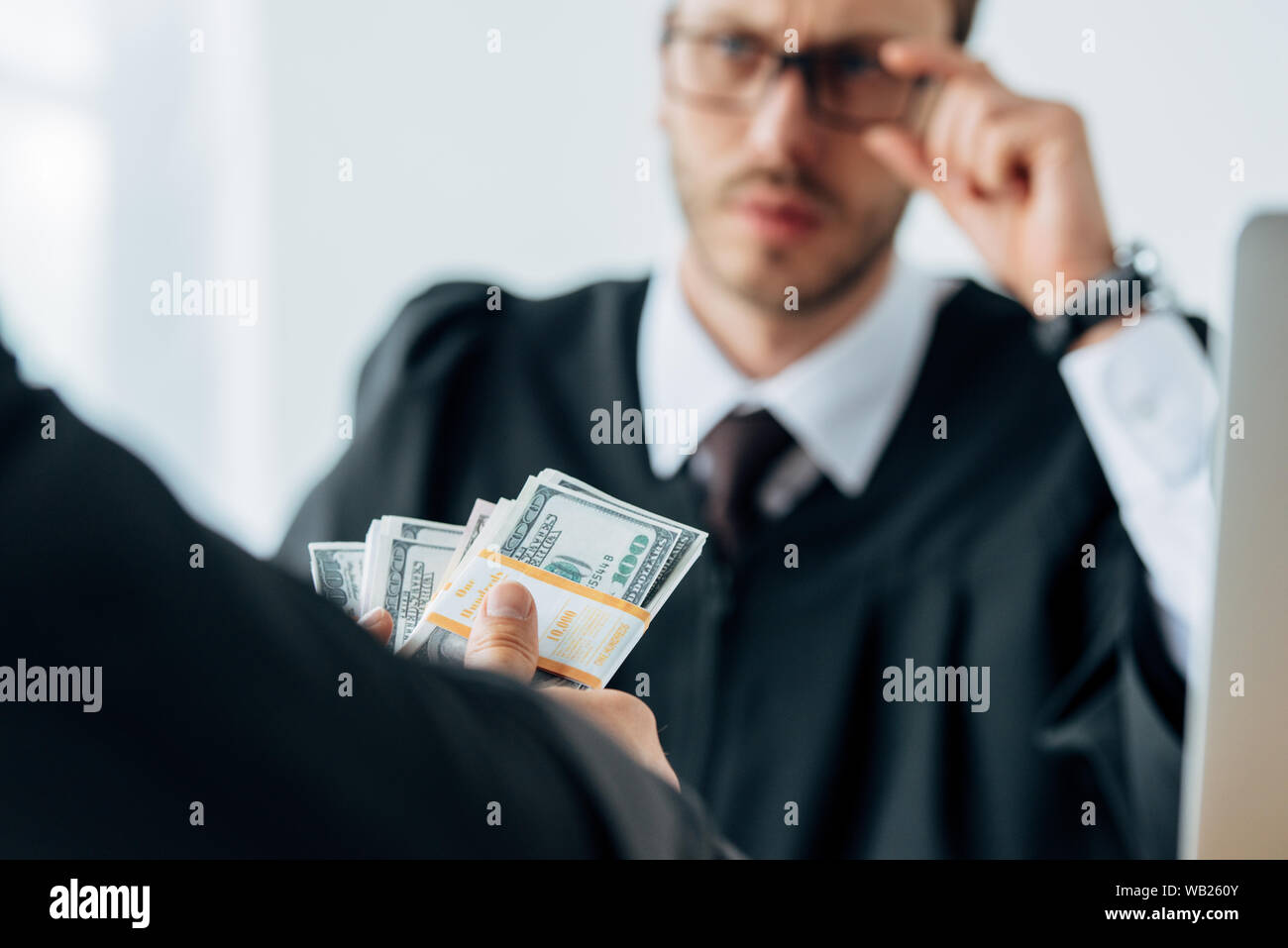 Judge holding cash hi-res stock photography and images - Alamy
