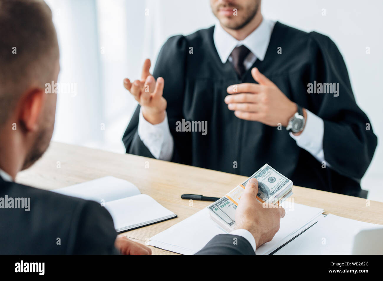 Handsome judge looking money hi-res stock photography and images - Alamy