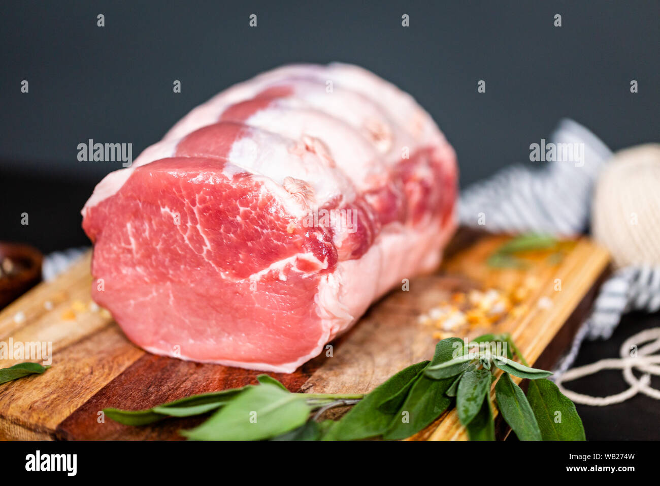 Uncooked boneless pork roast on the cutting board Stock Photo - Alamy