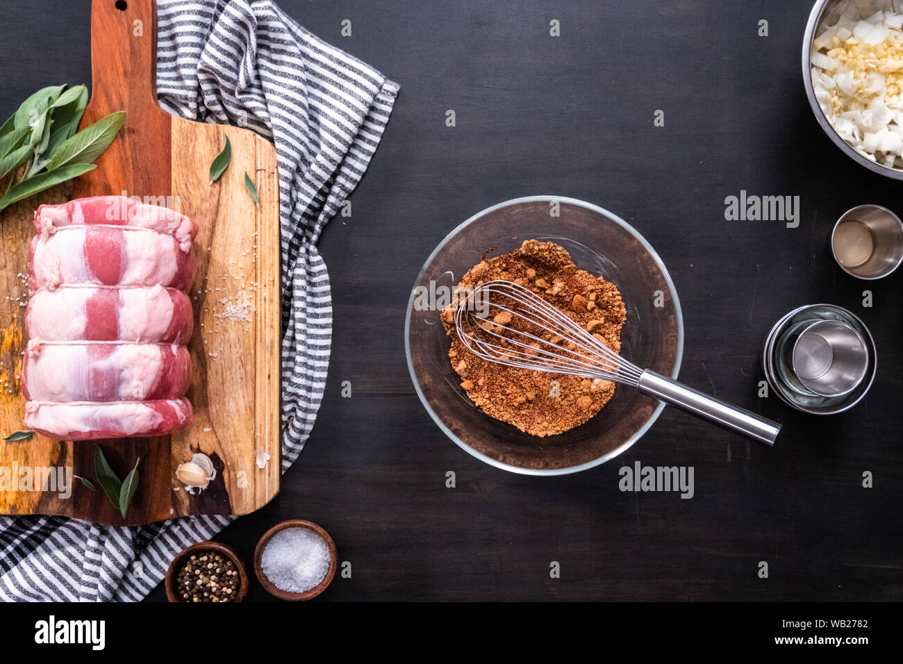Flat lay. Undercooked boneless pork roast on the cutting board Stock ...