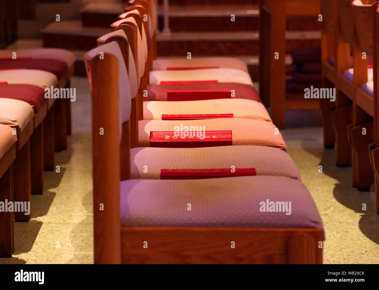 The only church hymnal book sandwiched between chairs with title ...
