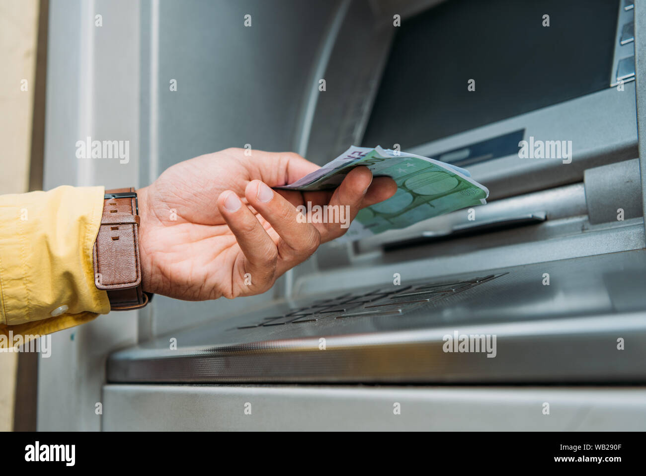 Taking money from cash machine hi-res stock photography and images - Alamy