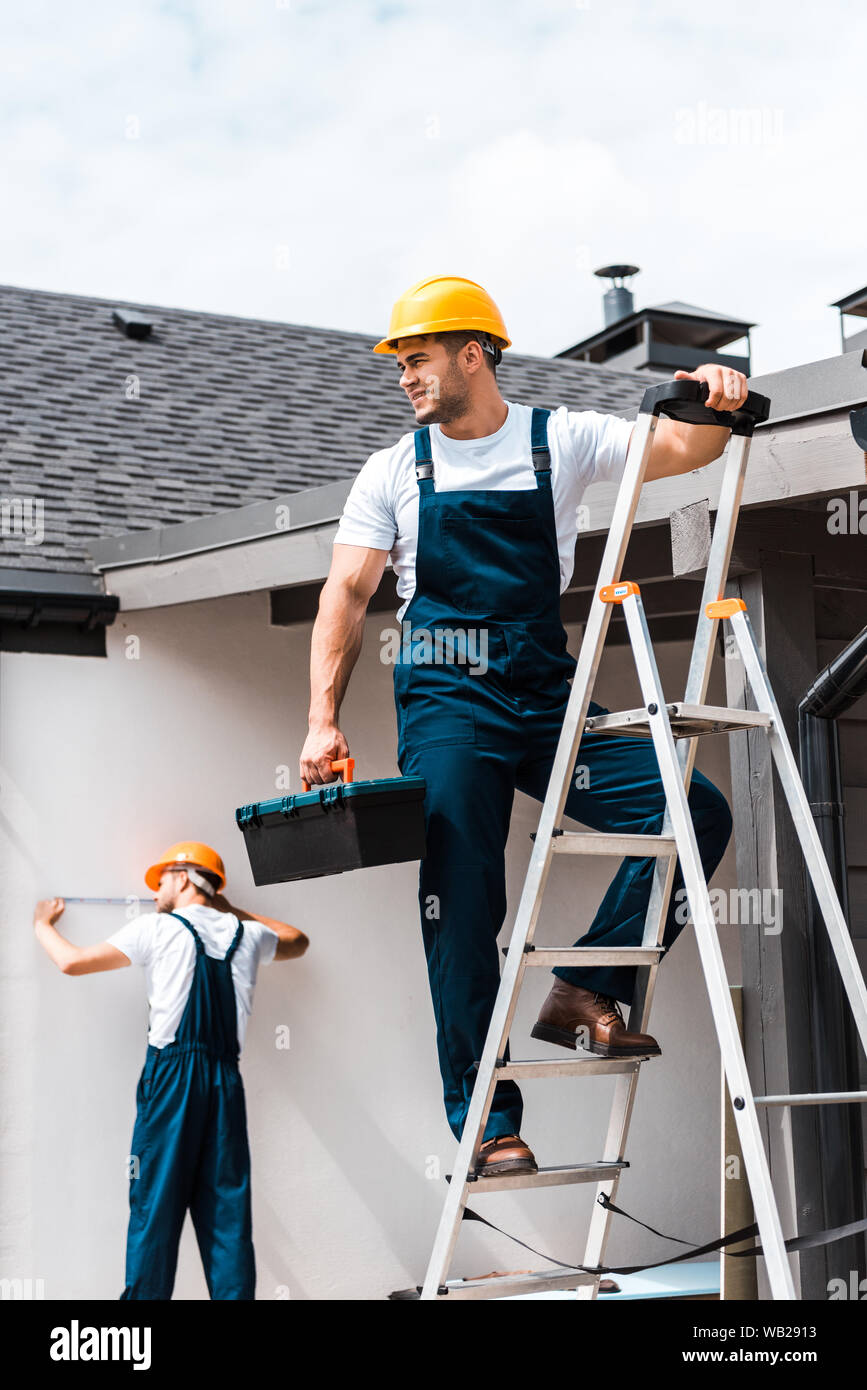 Workman standing ladder hi-res stock photography and images - Alamy