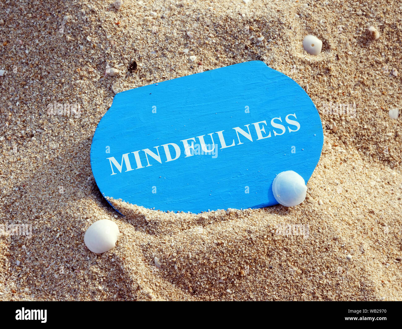 Mindfulness concept. Wooden plate on sand Stock Photo - Alamy
