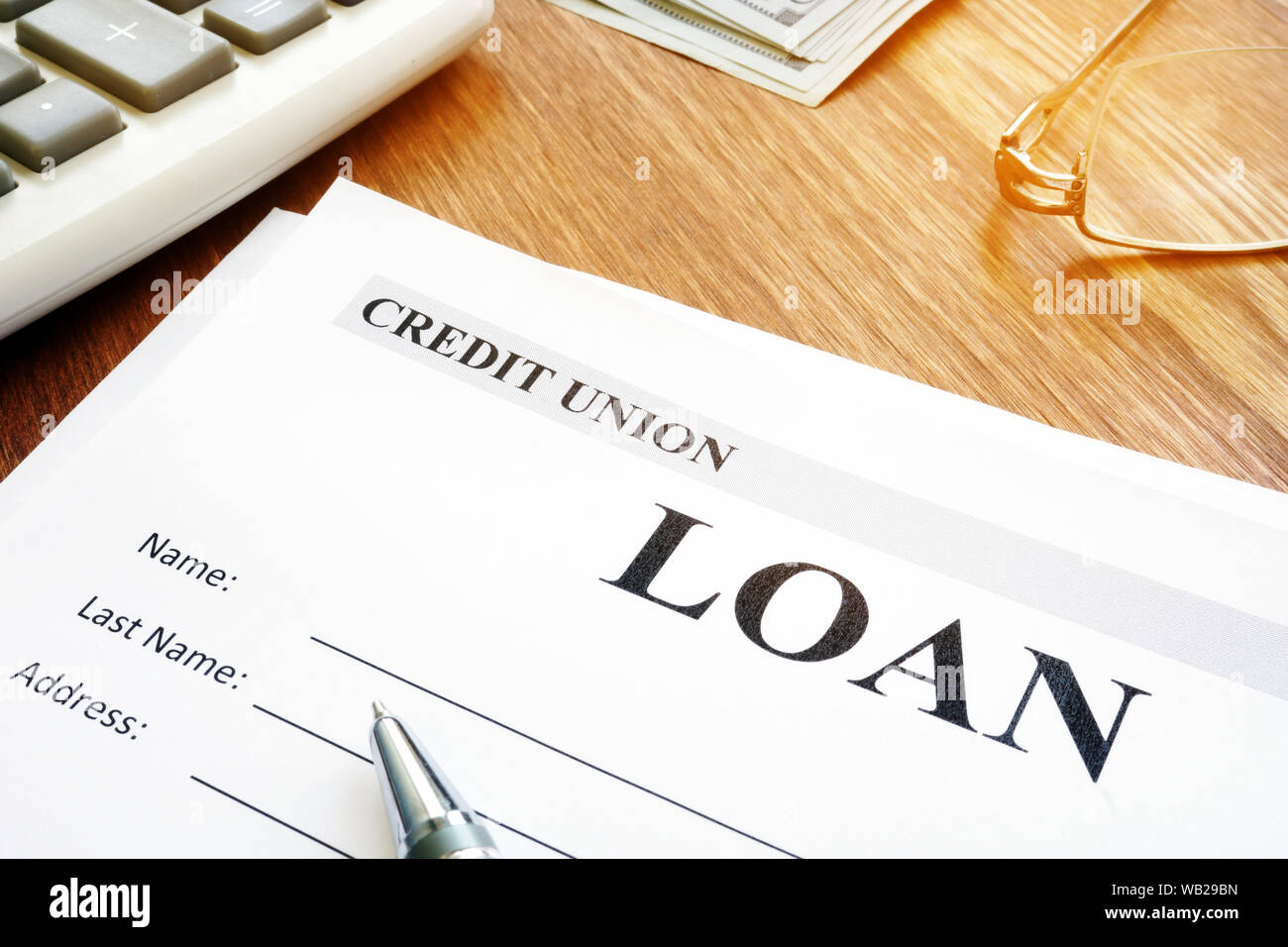 Credit union loan application form and pen Stock Photo - Alamy