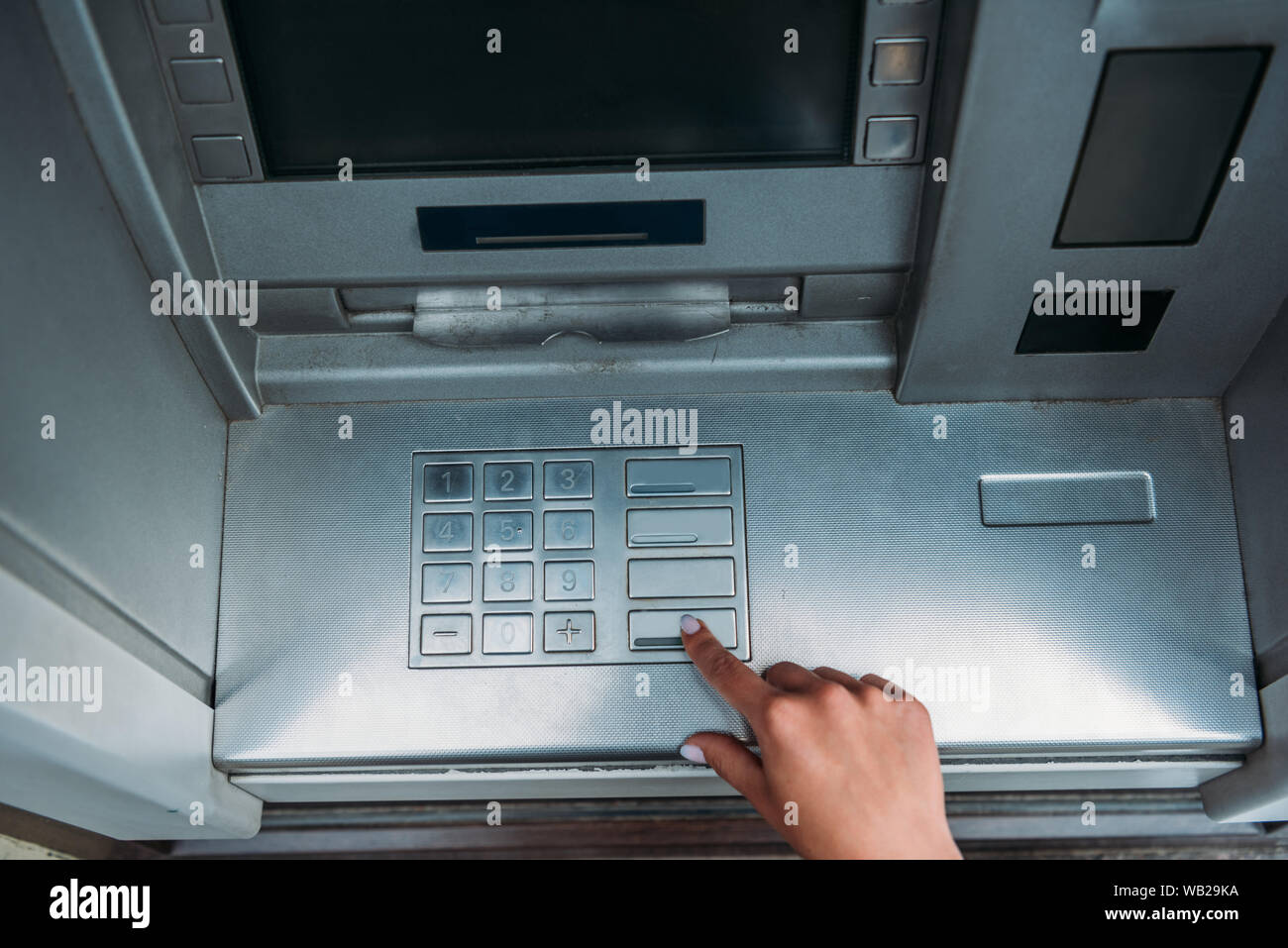top view of woman pushing button on atm machine Stock Photo - Alamy