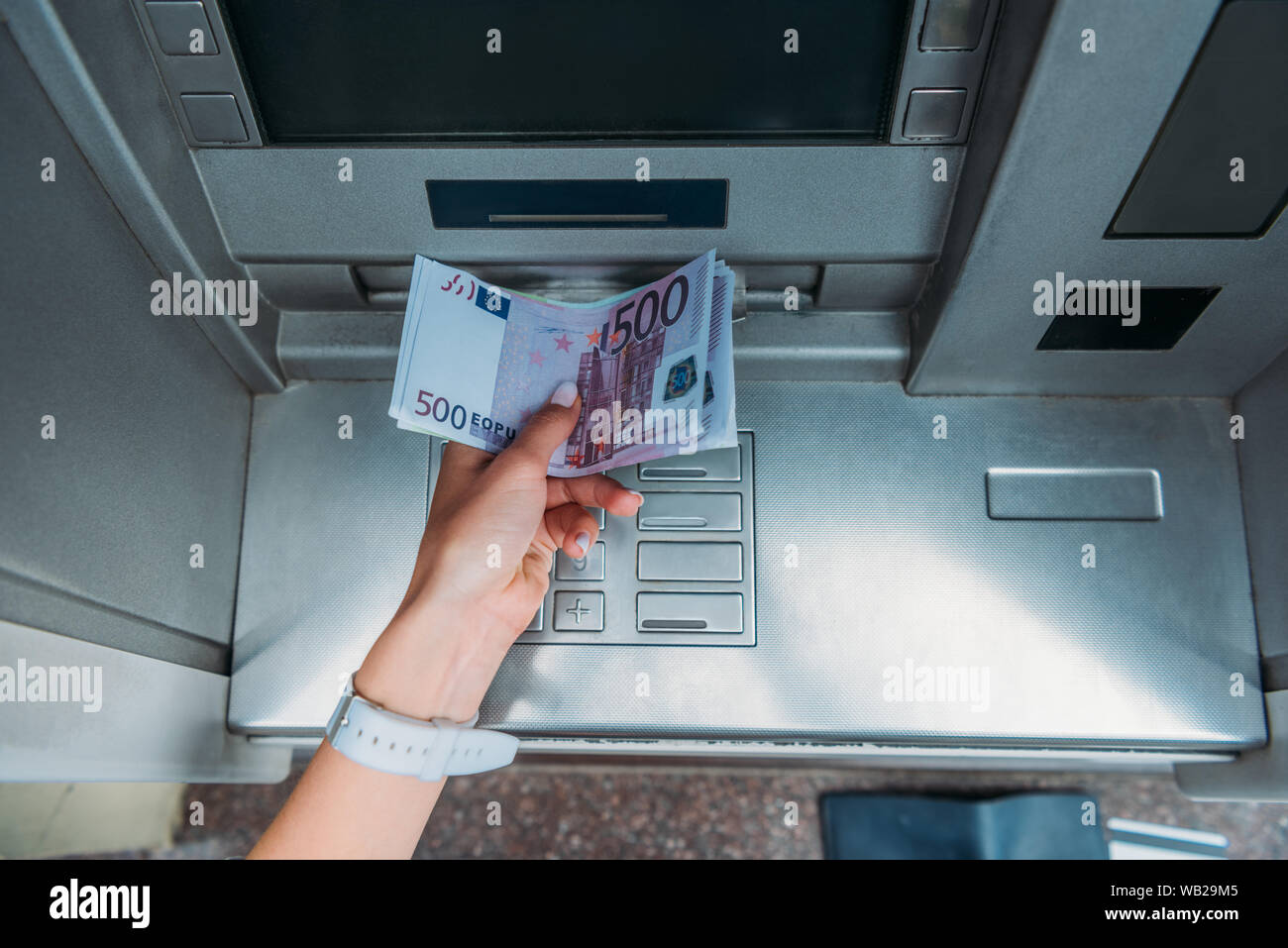 Taking money from cash machine hi-res stock photography and images - Alamy