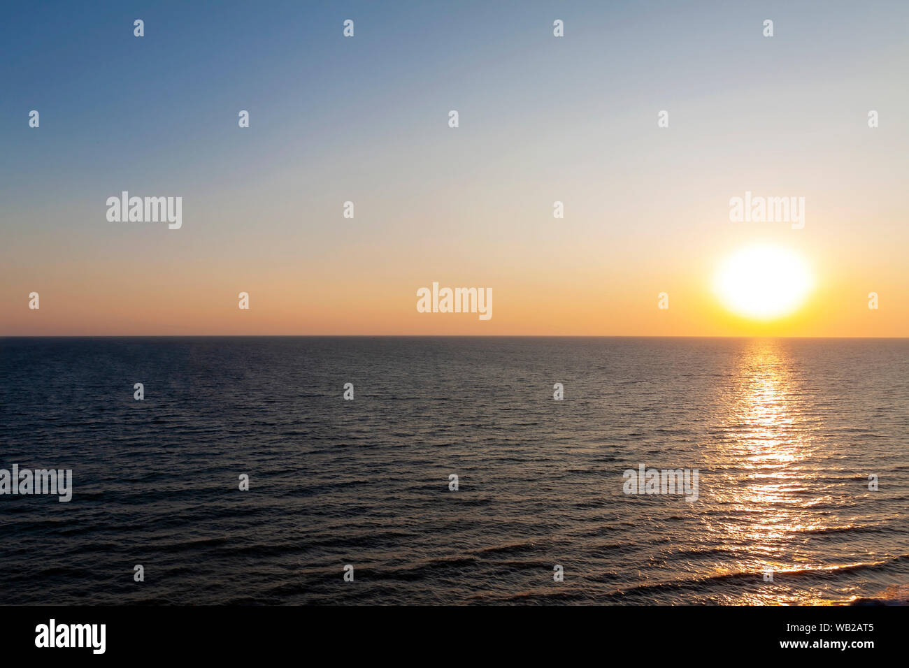 Evening sunset on the sea. The sun almost touched the horizon Stock ...