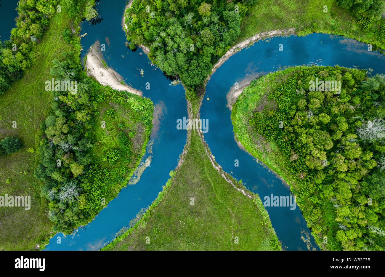 Top view of the beautiful landscape. Green field. Meandering river ...