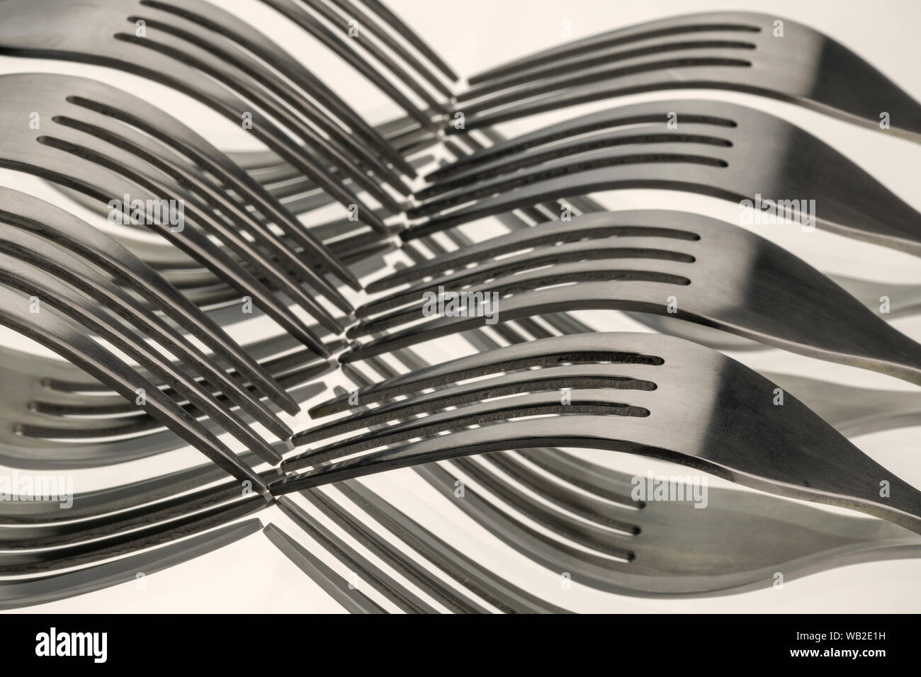 Abstract artistic picture of wavy forks, which form a wave pattern by ...