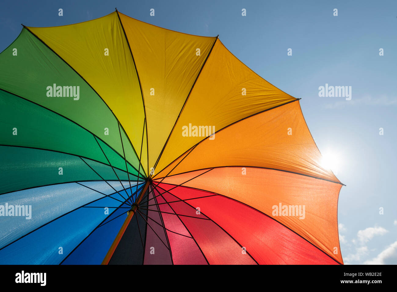 Colorful parasol in summer with backlight Stock Photo - Alamy