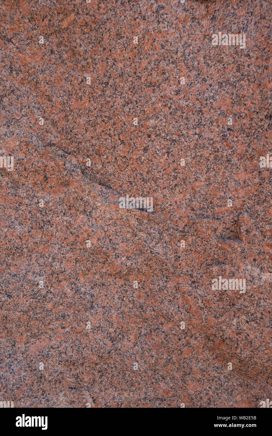 The structure of red and black granite. The texture of natural stone ...