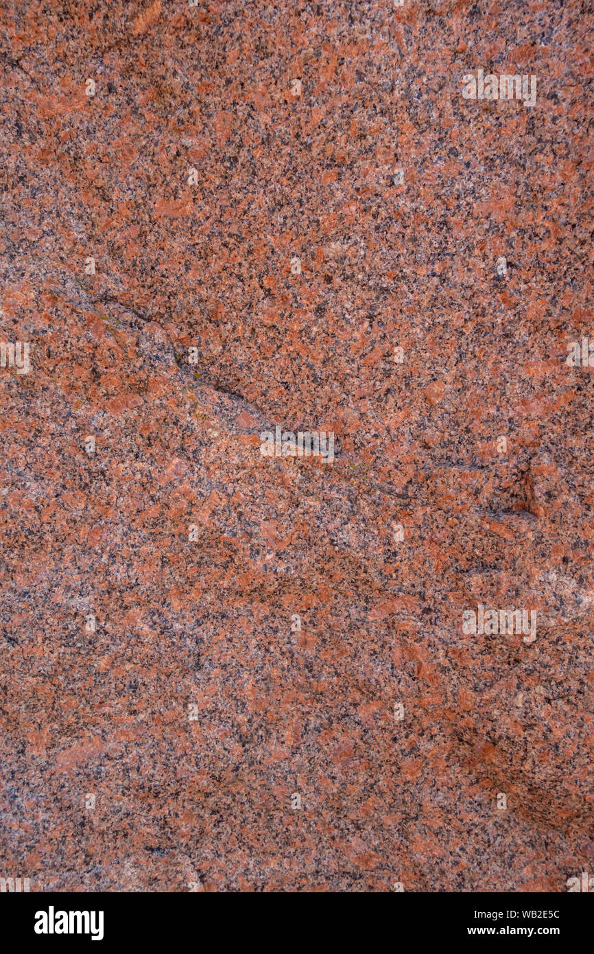 The structure of red and black granite. The texture of natural stone ...
