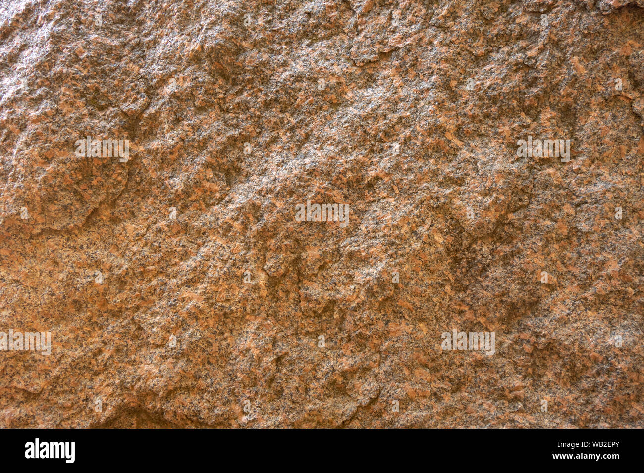 The structure of red and black granite. The texture of natural stone ...
