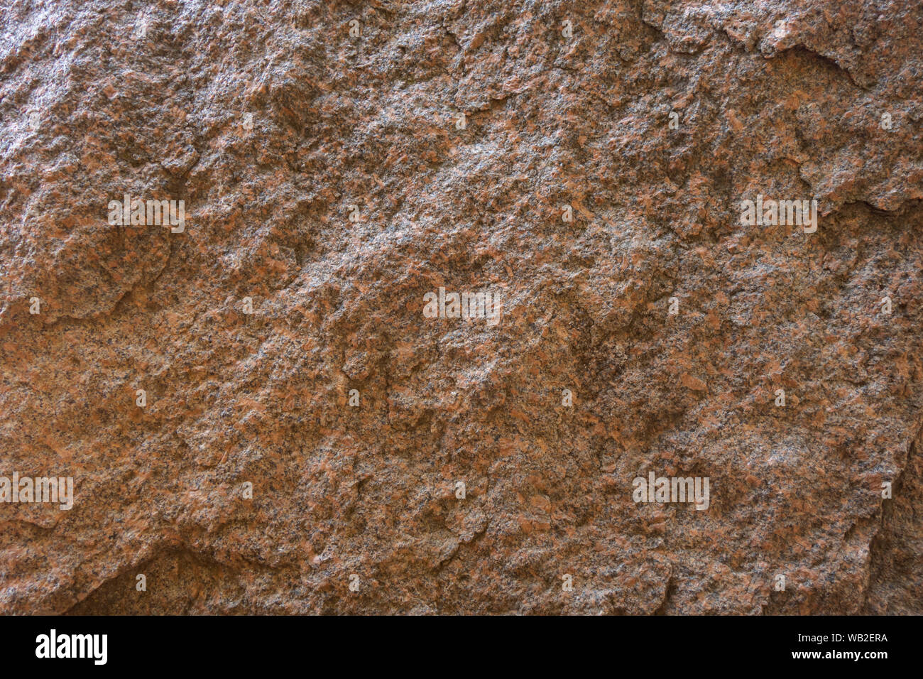 The structure of red and black granite. The texture of natural stone ...