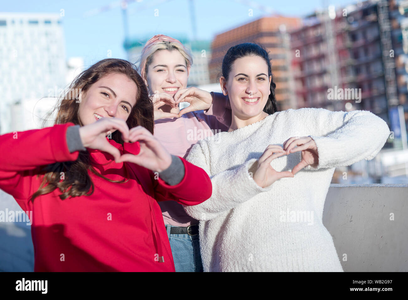 Heart shape from friends hands Stock Photo - Alamy