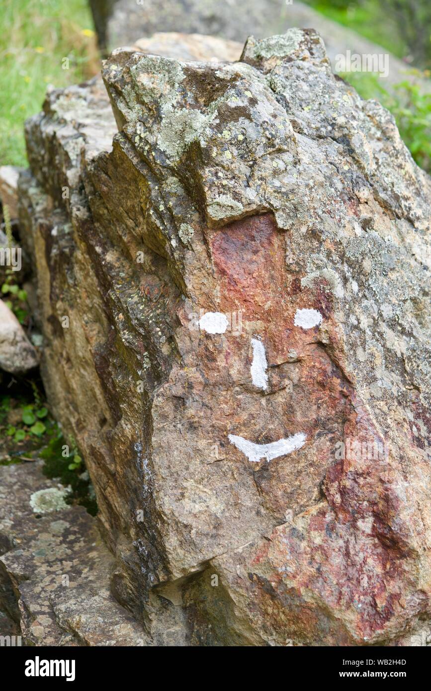 face on a natural stone Stock Photo - Alamy