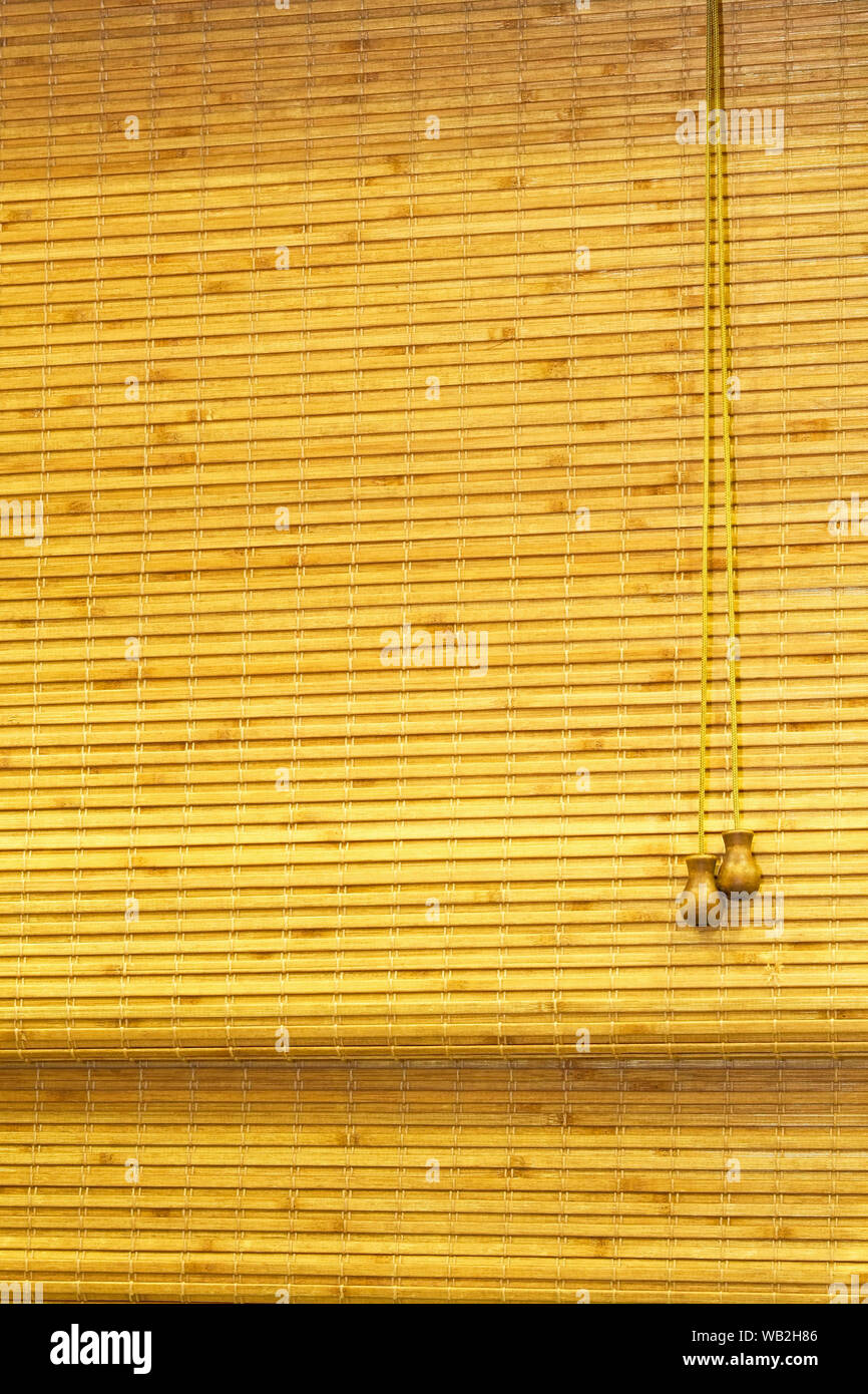 Window sun blind made from yellow rattan Stock Photo - Alamy
