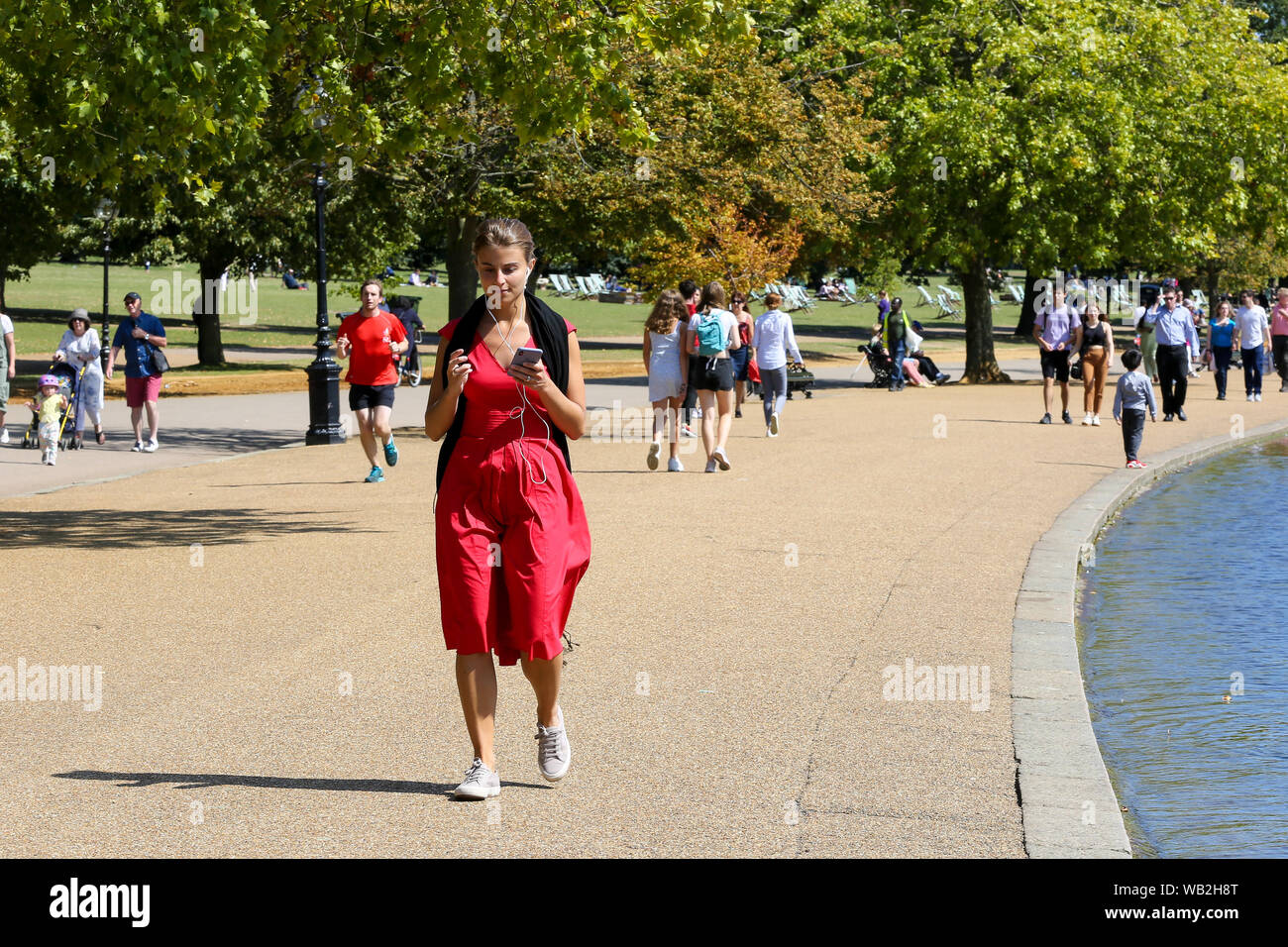 London, UK. 22nd Aug, 2019. People seen at the Hyde Park on a sunny and ...