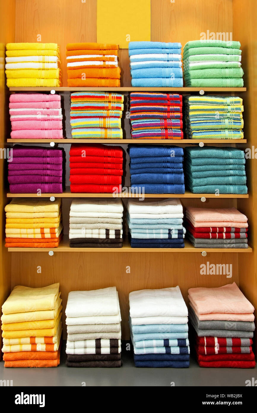 Big shelf with bunch of colorful towels Stock Photo - Alamy