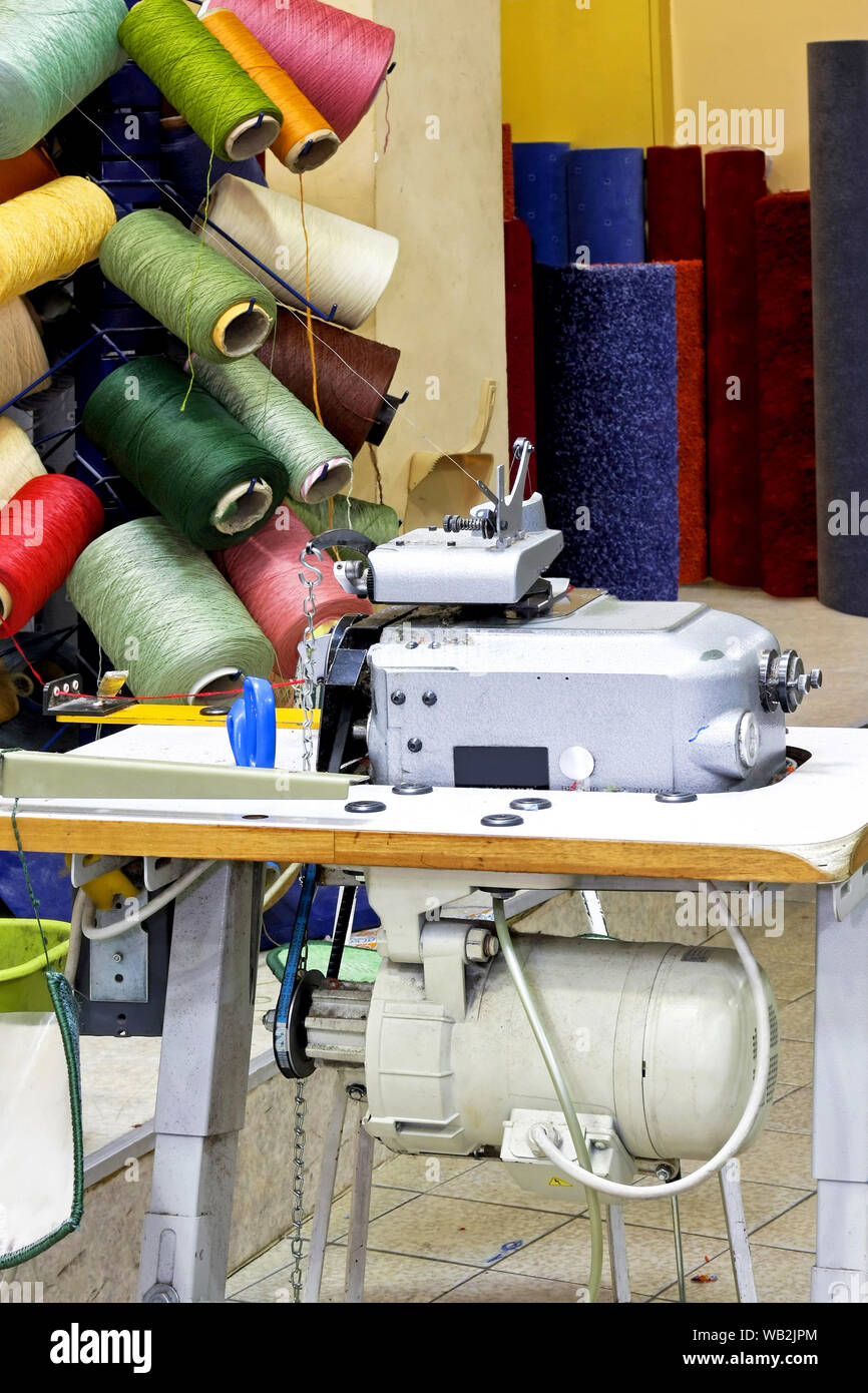 Professional sewing machine with big yarn spools Stock Photo - Alamy